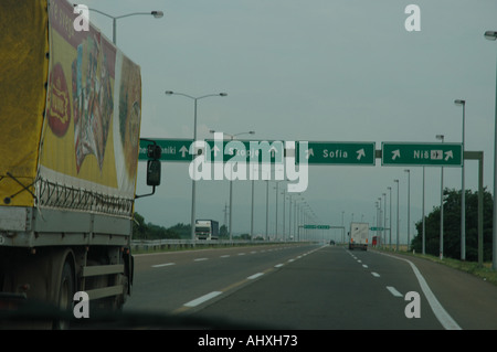 Serbia - Traffic signs on the road in front of a railroad crossing ...