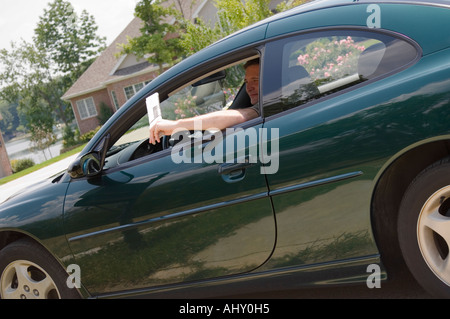 Man delivering newspaper Stock Photo - Alamy