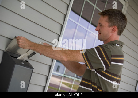 Newspaper carrier delivering newspapers Stock Photo - Alamy