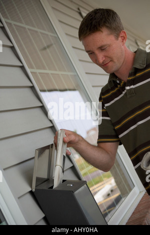 Newspaper delivery person delivering newspapers Stock Photo - Alamy