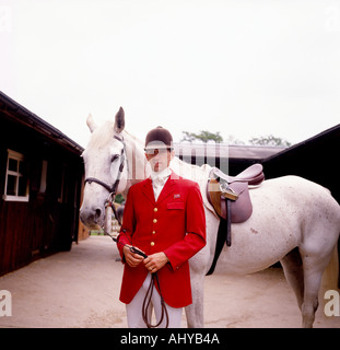 Equestrian sport. Portrait sports red stallion in the double bridle ...
