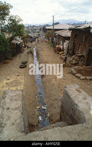 Children living in slums play in the flooded waters on the railway ...