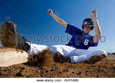 Close up of baseball player sliding into home plate Stock Photo ...