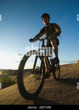 Portrait of man riding mountain bike in park Stock Photo - Alamy