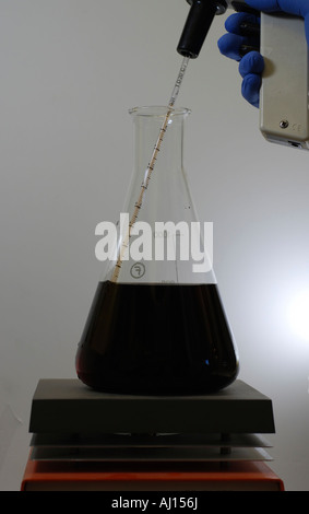 Sampling chemical compounds with a Beaker and Pipette Stock Photo - Alamy