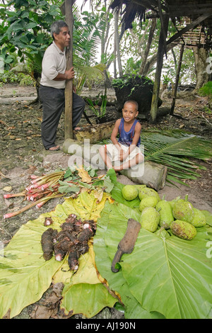 Kosrae, Micronesia (FSM). Local Kosrae man and his son at a traditional ...