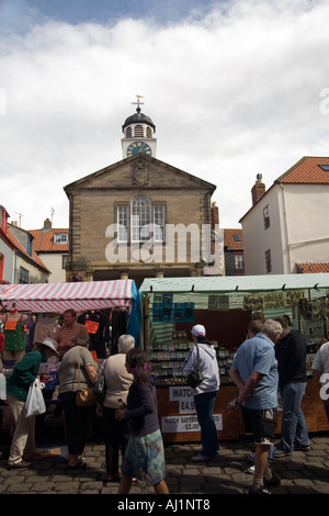 People shopping in Whitby market place and the Old Town Hall, North ...