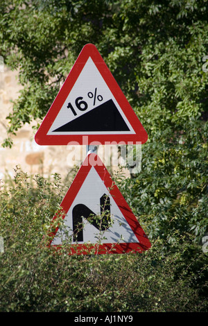 traffic sign gradient 16%, steep road ahead, red triangle, tree in ...