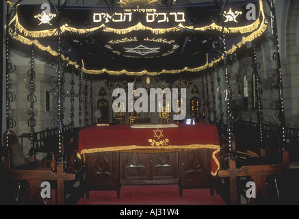 Interior of a synagogue with bimah in middle. Synagogue is Jewish house ...
