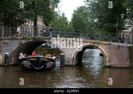 Canal boat passes under a bridge on the Trent and Mersey Canal near the ...