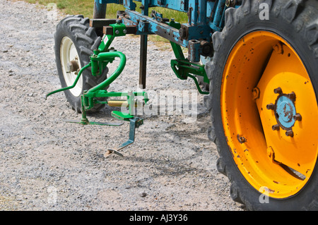 A vineyard tractor equipped with knifes to mechanically cut off remove ...