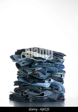 Close up denim jeans stacked in shop. Jeans a stack of folded pairs of ...
