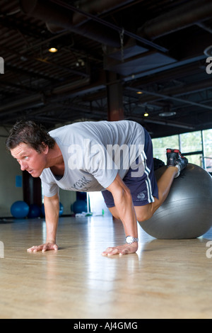 Fit male exercising in a gym Workout Stock Photo - Alamy
