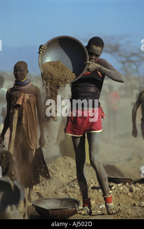 Gold panners dry hand panning for gold in Turkana Kenya Stock Photo - Alamy