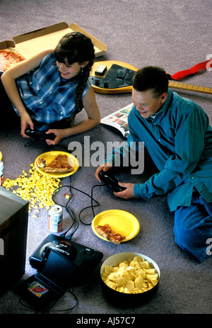 Girl playing video game while lying on bed at home Stock Photo - Alamy