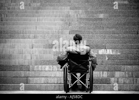 Disabled man in a wheelchair confronting a police line in full riot ...