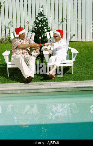 A senior man pulling a Christmas tree in forest Stock Photo - Alamy