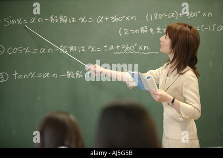 Japanese high school girls dressed in yukata for the school festival ...
