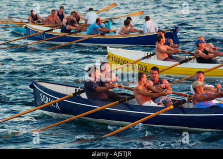 Gig Racing on the Isles of Scilly, Uk with Lifeboat in the distance ...