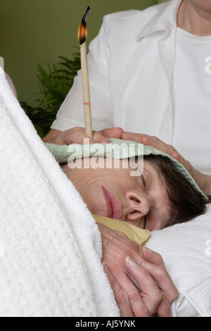 Hopi Ear candle treatment. For calming the mind Stock Photo - Alamy