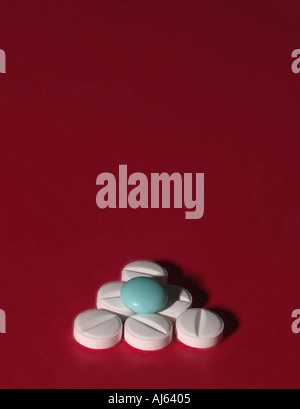Red triangle pills Stock Photo - Alamy