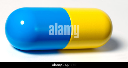 yellow capsule medicine for health isolated on white background Stock ...