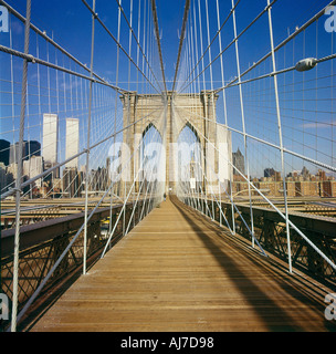 USA, New York City, Brooklyn, woman picking up jigsaw pieces from ...