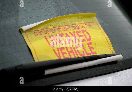 A notice is displayed on an untaxed vehicle advising that a report has ...