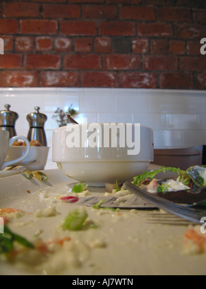 Empty soup bowl and plate with crumbs overhead on wood horizontal Stock ...