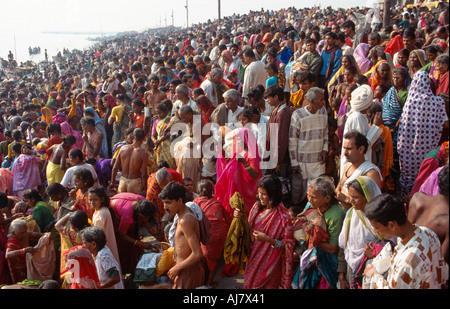 Hindu pilgrims gathering at a ghat to bathe in the Ganges river in ...