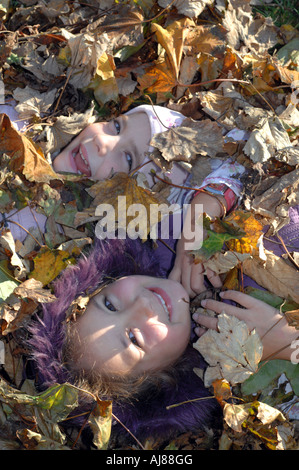 Happy children play in autumn forest. Happy family, friendship, love ...