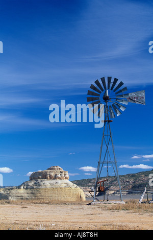 USA Utah Old farm windmill and Church Rock in high desert south of Moab ...