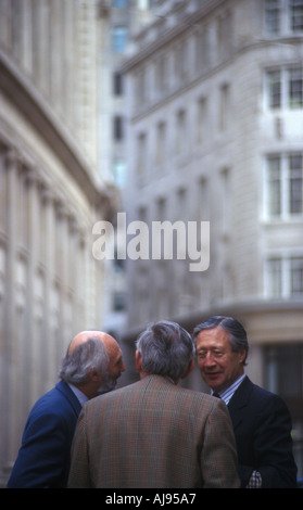 Three men in conversation outside the Mercado de San Miguel Madrid ...