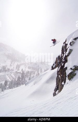 Snow skier flying off cliff Stock Photo - Alamy