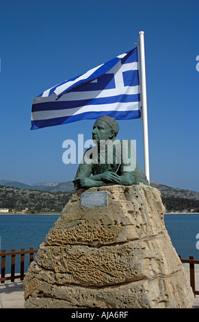 Statue with Greek flag above at entrance to Argostoli Port and Harbour ...
