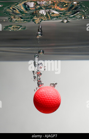 golf ball falling into water Stock Photo - Alamy