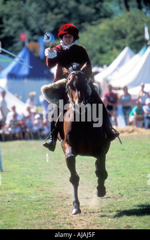 Skills at arms event including lancing oranges Stock Photo - Alamy