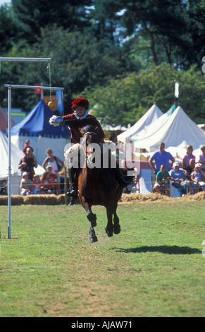 Skills at arms event lancing rings with a sword at Herstmonceux castle ...