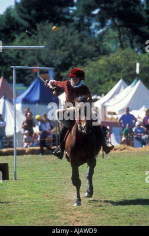 Skills at arms event lancing rings with a sword Stock Photo - Alamy
