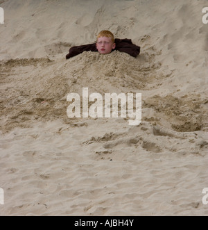 Young boy playing dead on the floor Stock Photo - Alamy