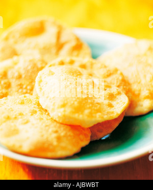 Poori (A delicious and crispy Indian deep fried bread Stock Photo - Alamy