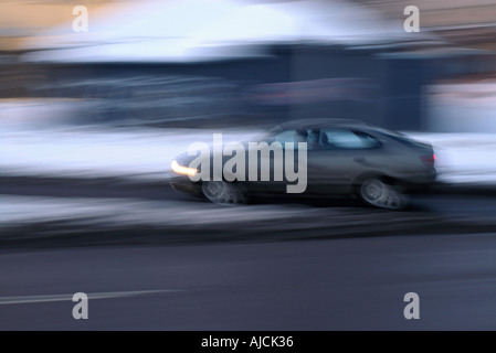 Fast moving car on a winter alpine snowy road Stock Photo - Alamy