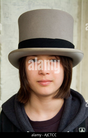 Eccentric young boy wearing an old top hat Stock Photo - Alamy