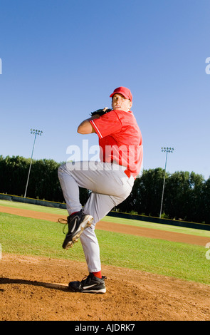 Sports, pitcher and throwing with man on field for fitness, workout or ...