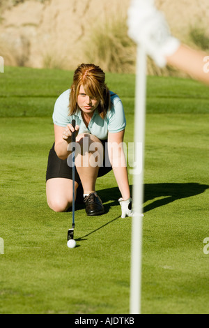 golfer putting, selective focus on golf ball Stock Photo - Alamy
