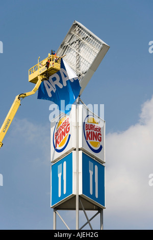Installation of the ARAL Logo at a motorway service area with a crane ...
