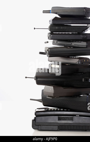 Stack of cell phones cut out on white background Stock Photo - Alamy