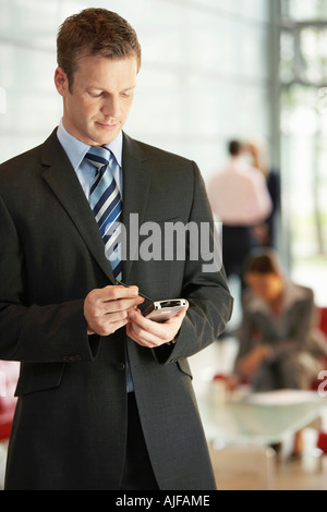 Businessman using PDA Stock Photo - Alamy