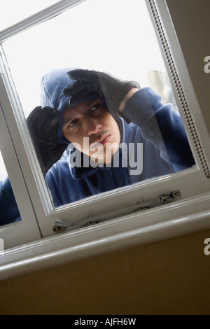 Burglar at a window Stock Photo - Alamy