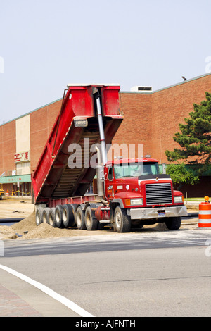 Large tipper truck carrying sand along a Spanish beach in order to ...